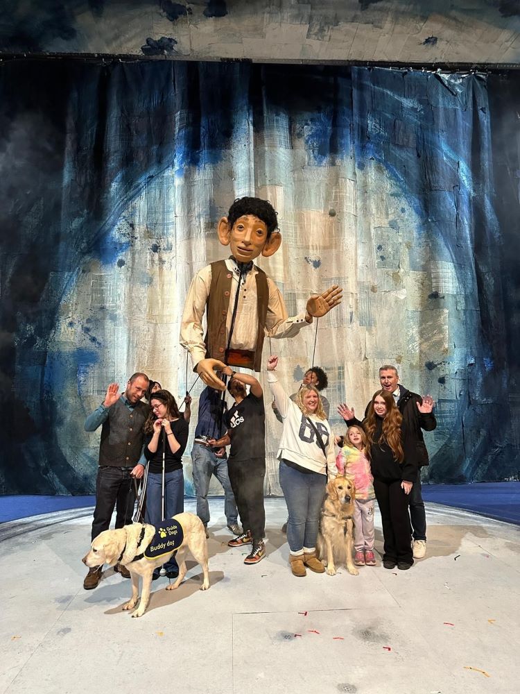 Youngsters and their Buddy Dogs enjoy a special touch-tour performance ...